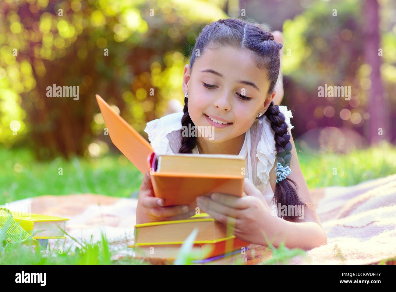Happy beautiful girl back to school and learning Stock Photo - Alamy