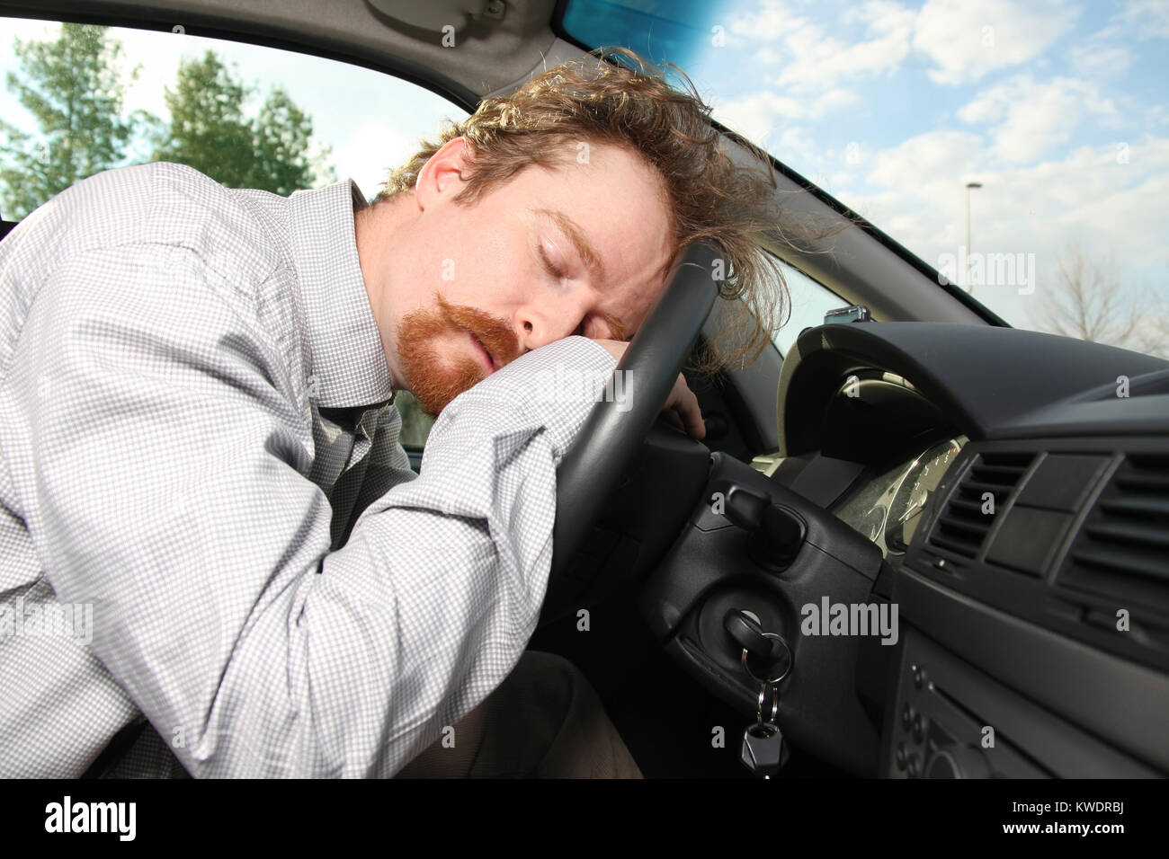 tired driver sleeps in a car Stock Photo - Alamy