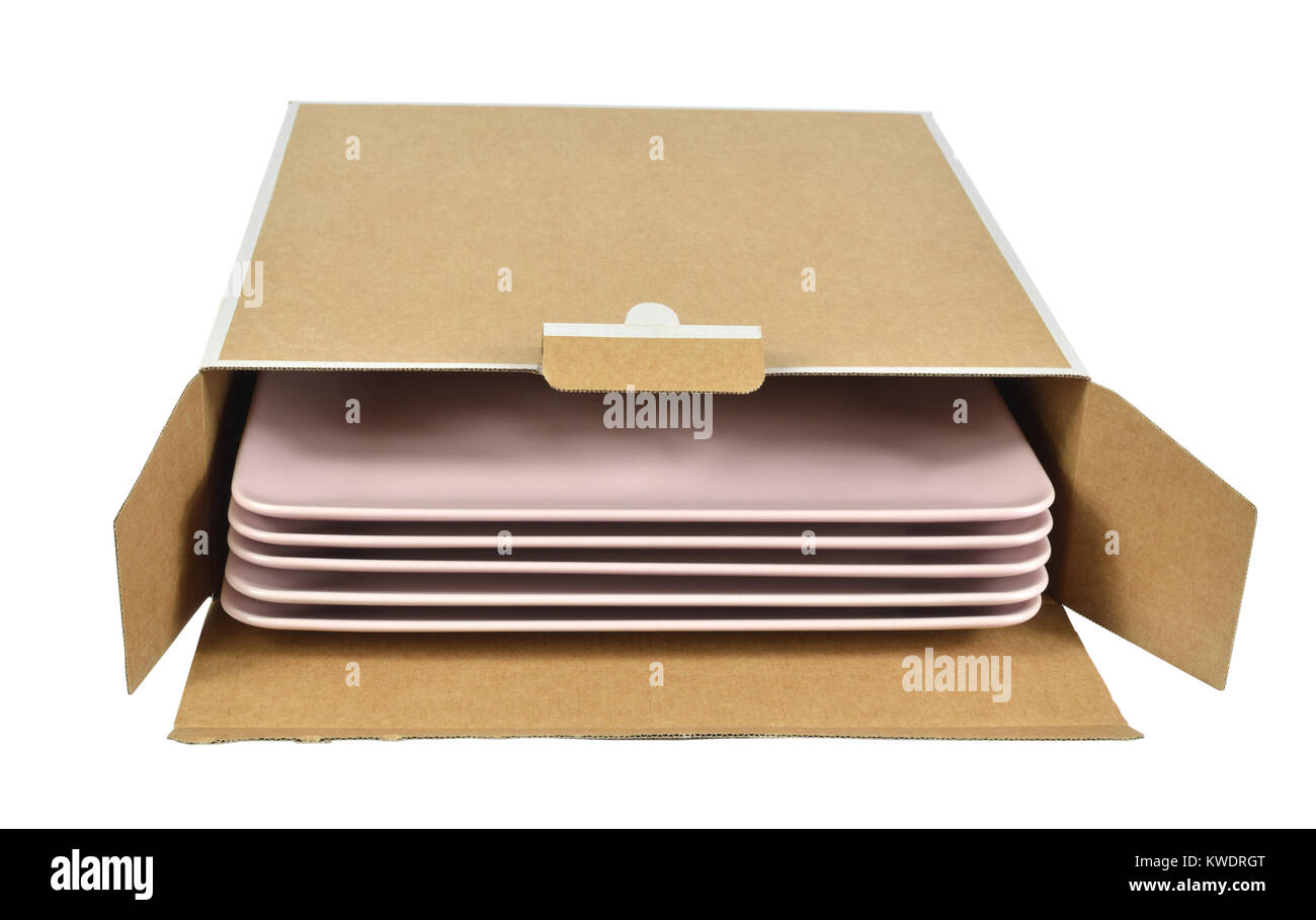 Open cardboard box with a stack of square pink plates, isolated on ...