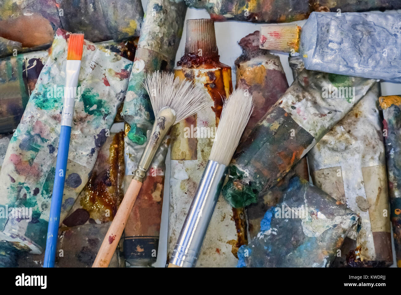 Mess of artists oil colors in metal tubes viewed from above Stock Photo ...