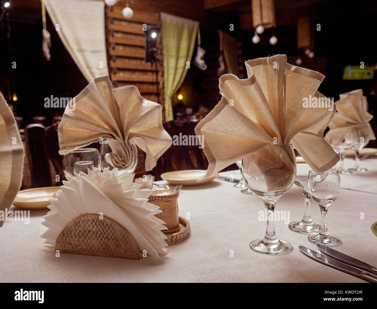 Decoration of the restaurant table. Napkins made of cotton are inserted ...