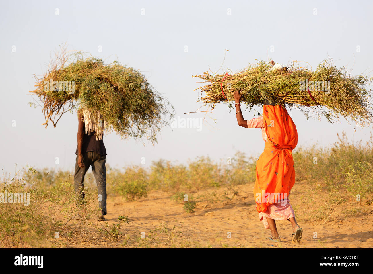Man carrying bundle hi-res stock photography and images - Alamy