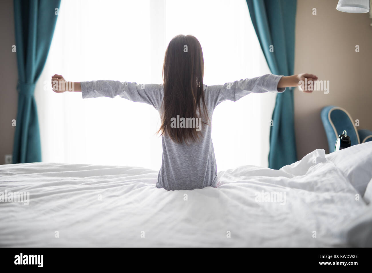 A nice child girl enjoys sunny morning. Good morning at home. Child ...