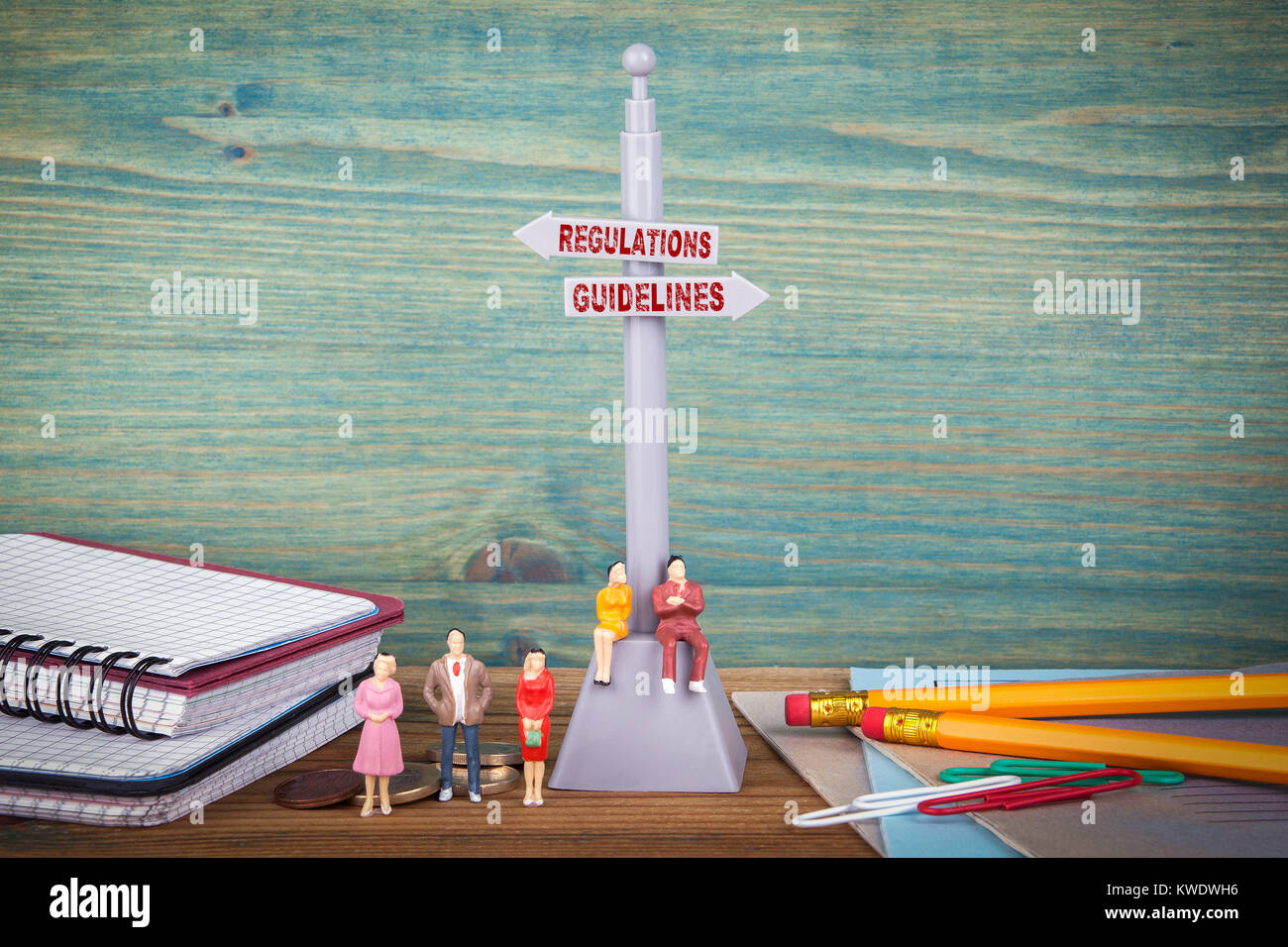 Regulations and Guidelines. Signpost on wooden table Stock Photo - Alamy