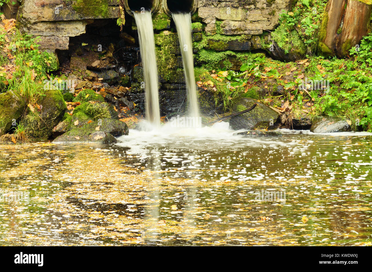 The water in the river falls from a height ,creating a spray Stock ...