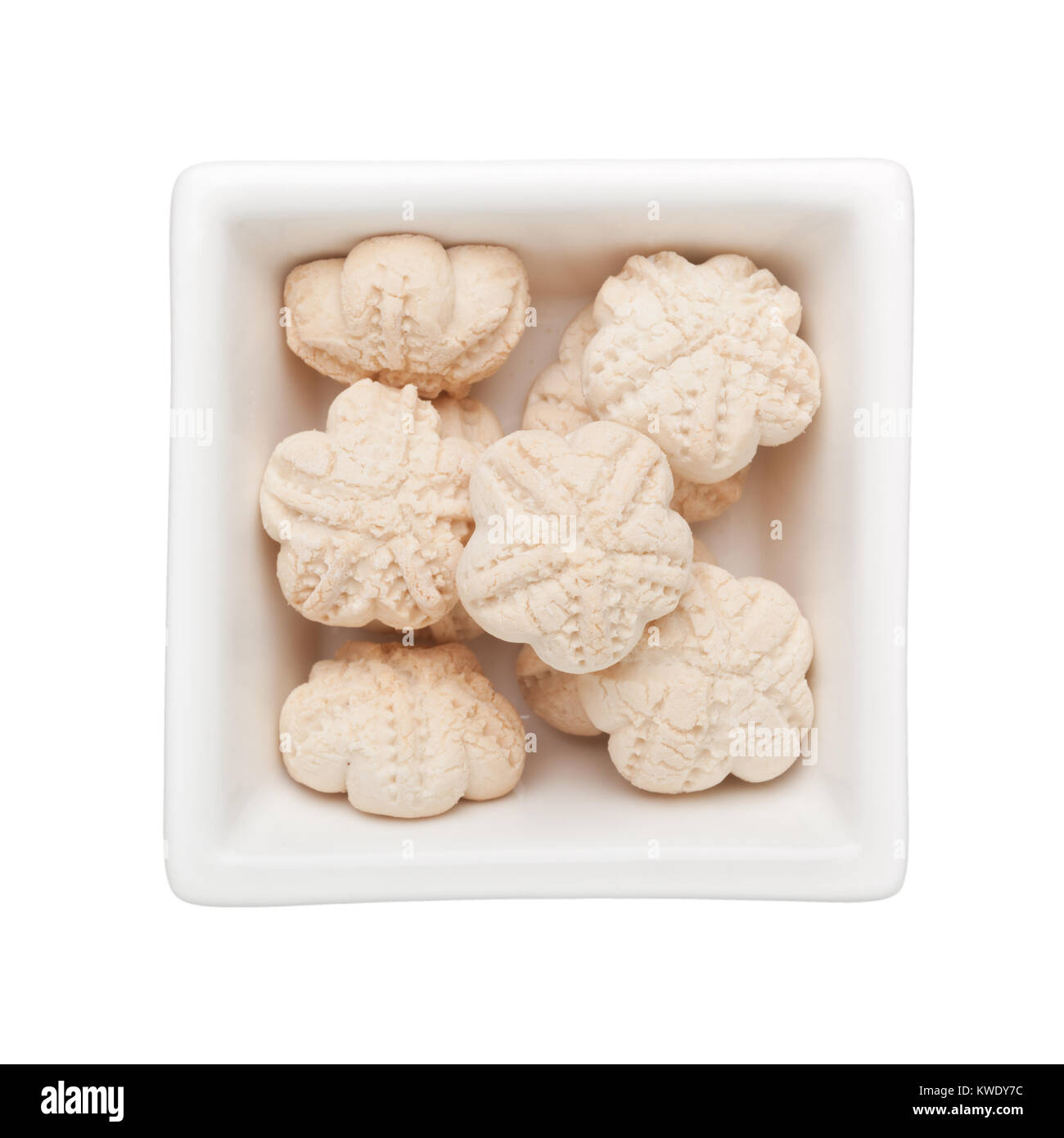 Kueh bangkit pastry in a square bowl isolated on white background Stock ...