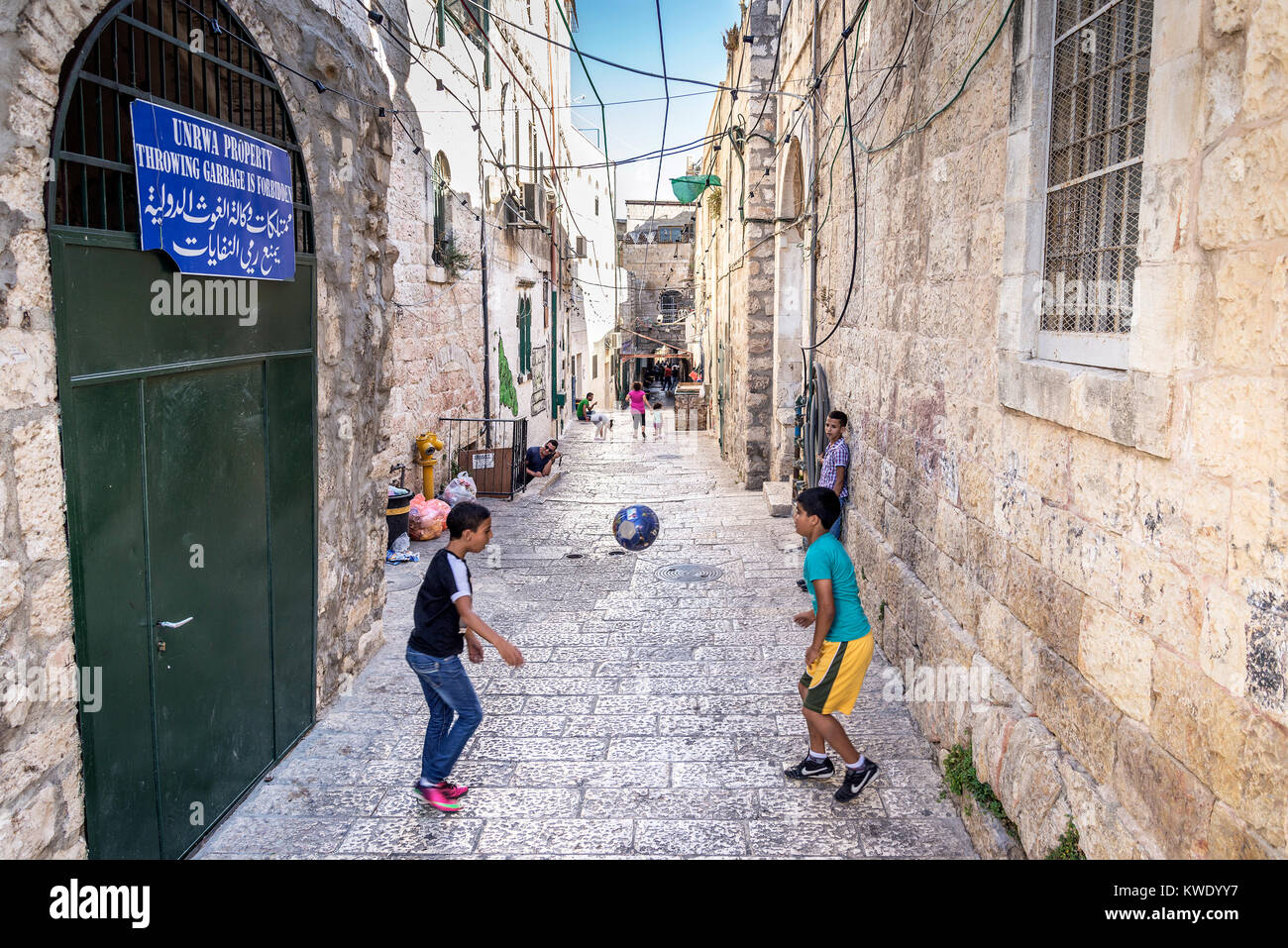 palestinian people in old town cobbled street scene of jerusalem city ...