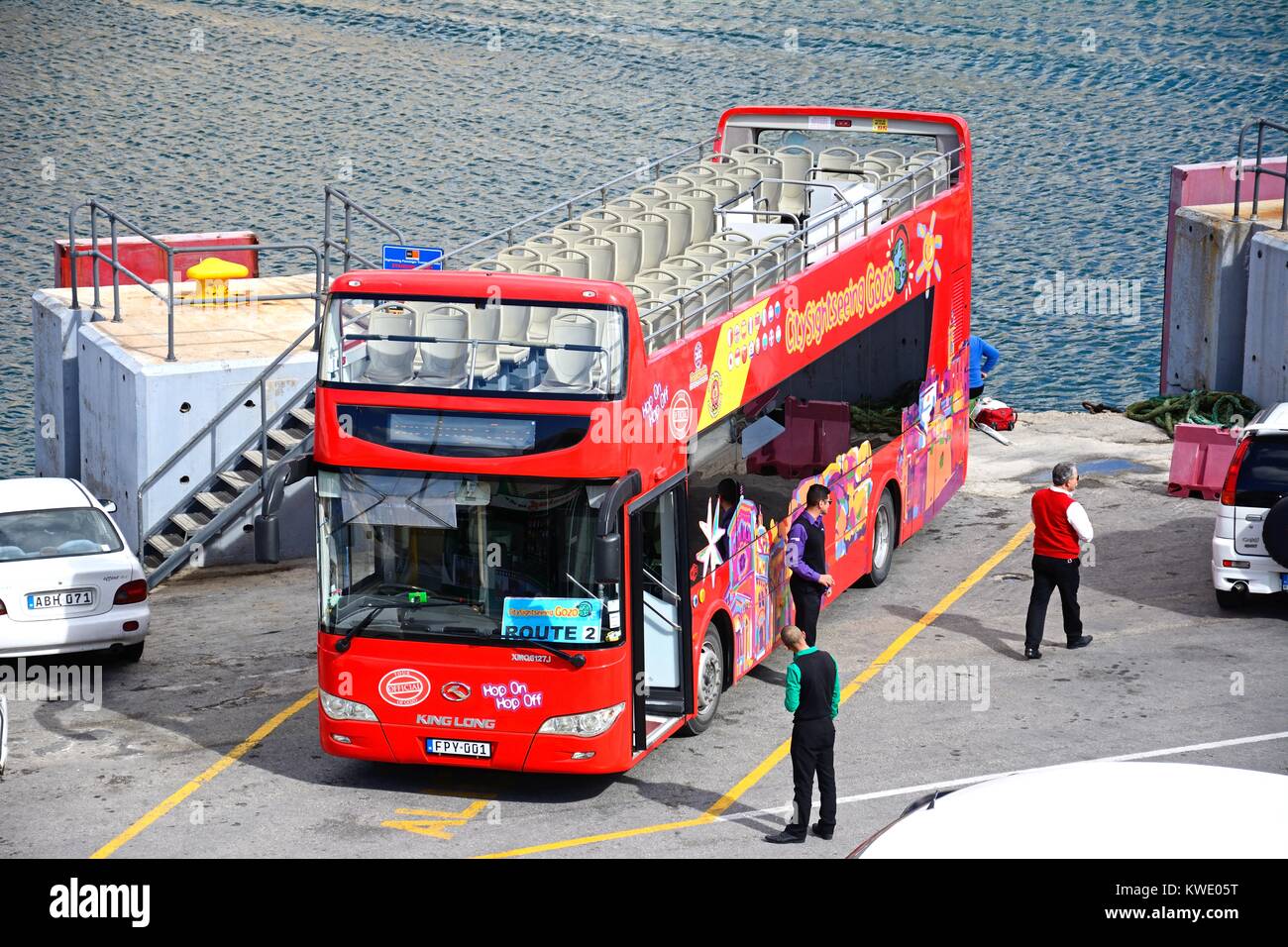 Elevated view of a Gozo city sightseeing tour bus, Mgarr, Gozo, Malta ...