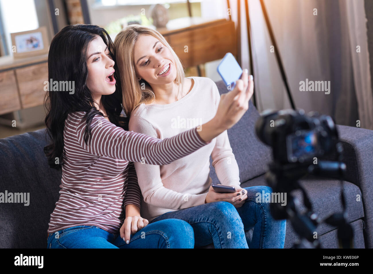 Joyful happy women taking selfies Stock Photo - Alamy