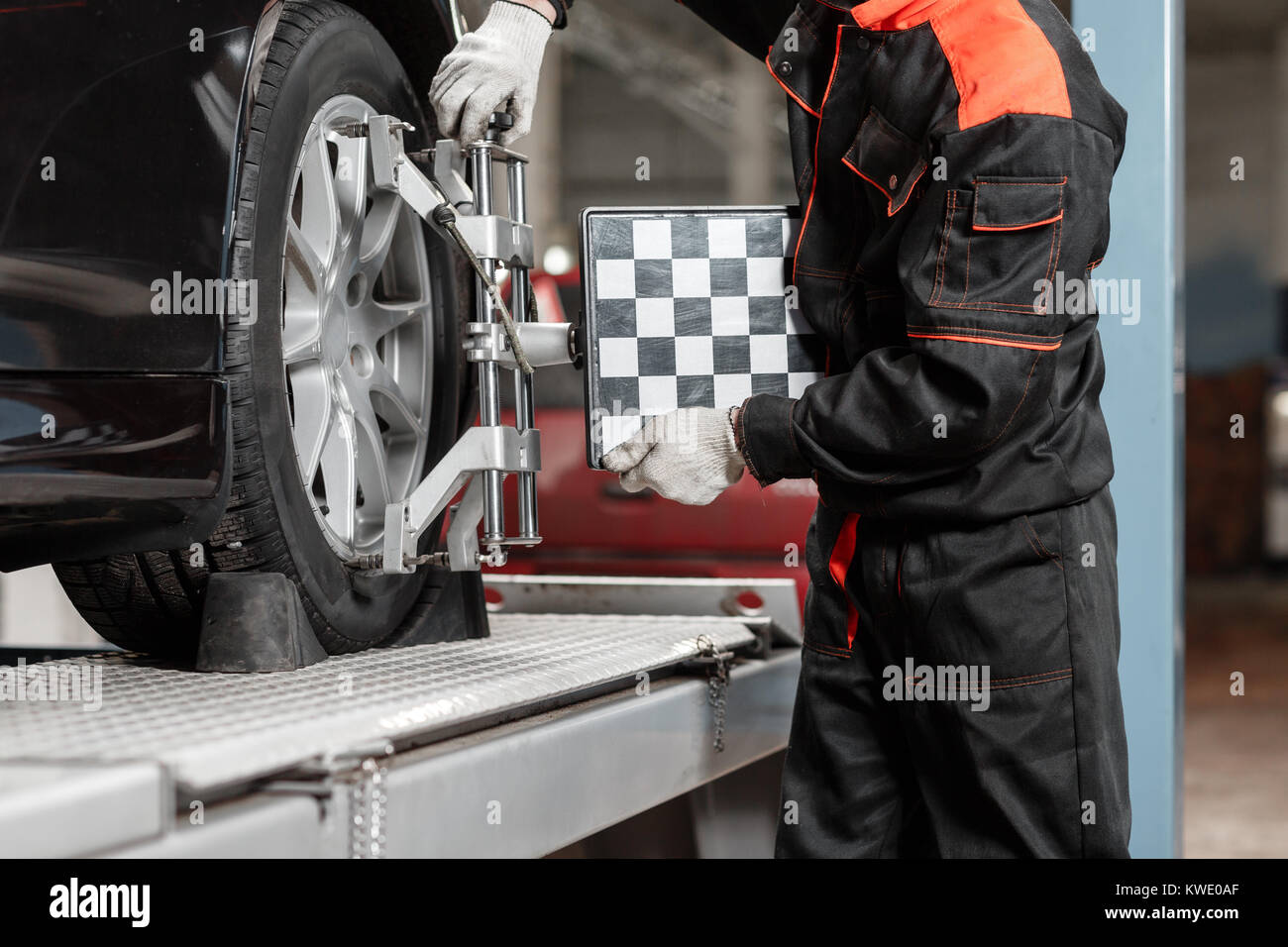 auto mechanic sets the car for diagnostics and configuration. Wheel ...