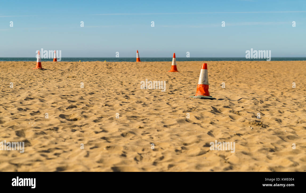 Pylons on the beach, seen in Aberporth Bay, Ceredigion, Dyfed, Wales ...
