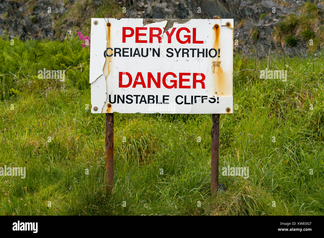 Sign: Danger unstable cliffs (Welsh & English), seen in Aberystwyth ...