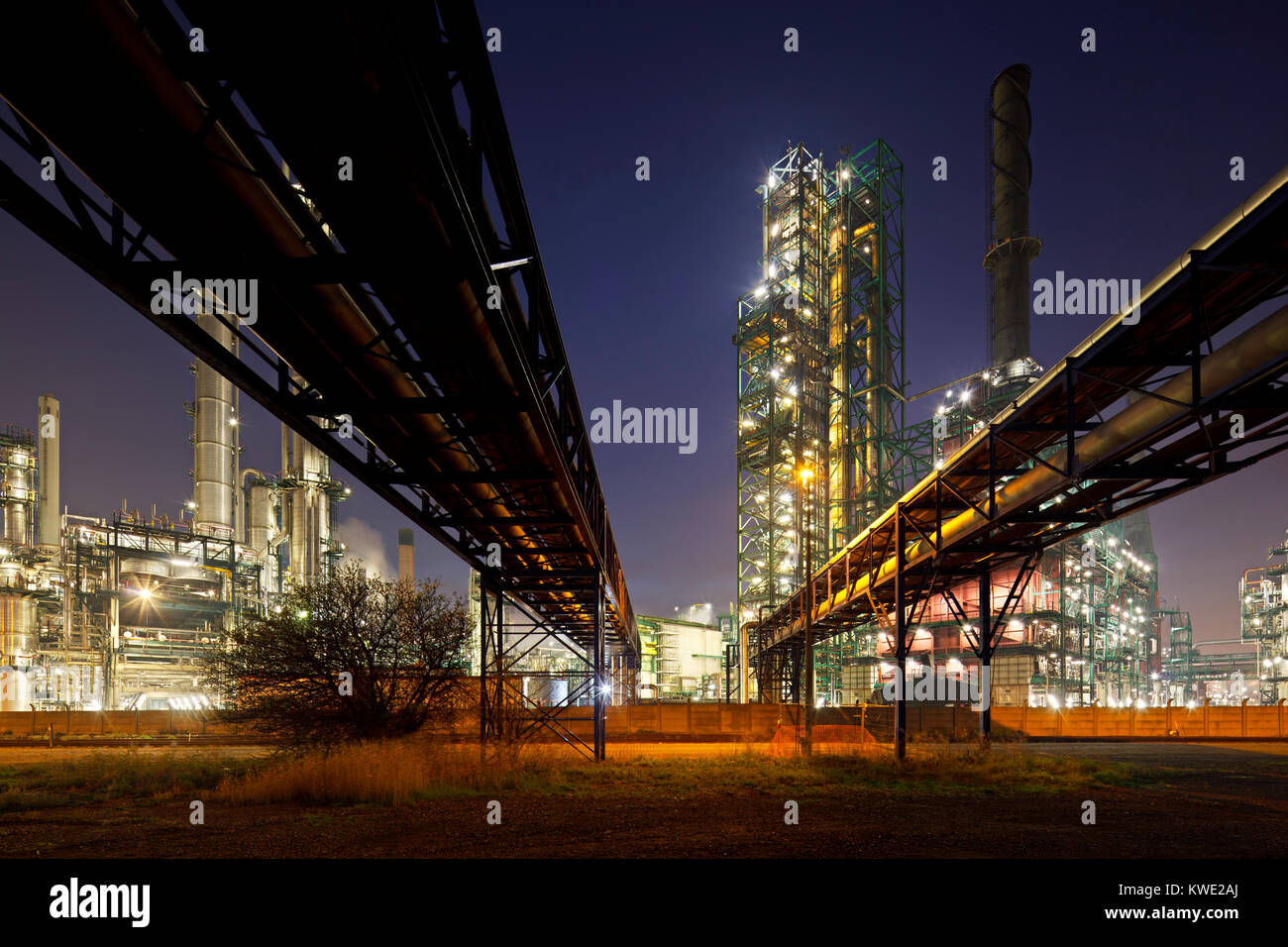 An oil refinery in the harbor of Antwerp with night blue sky, two ...