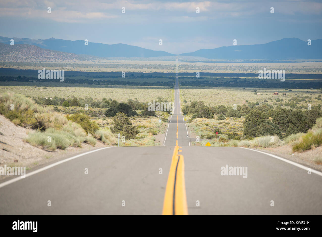 Country road on rolling landscape Stock Photo - Alamy