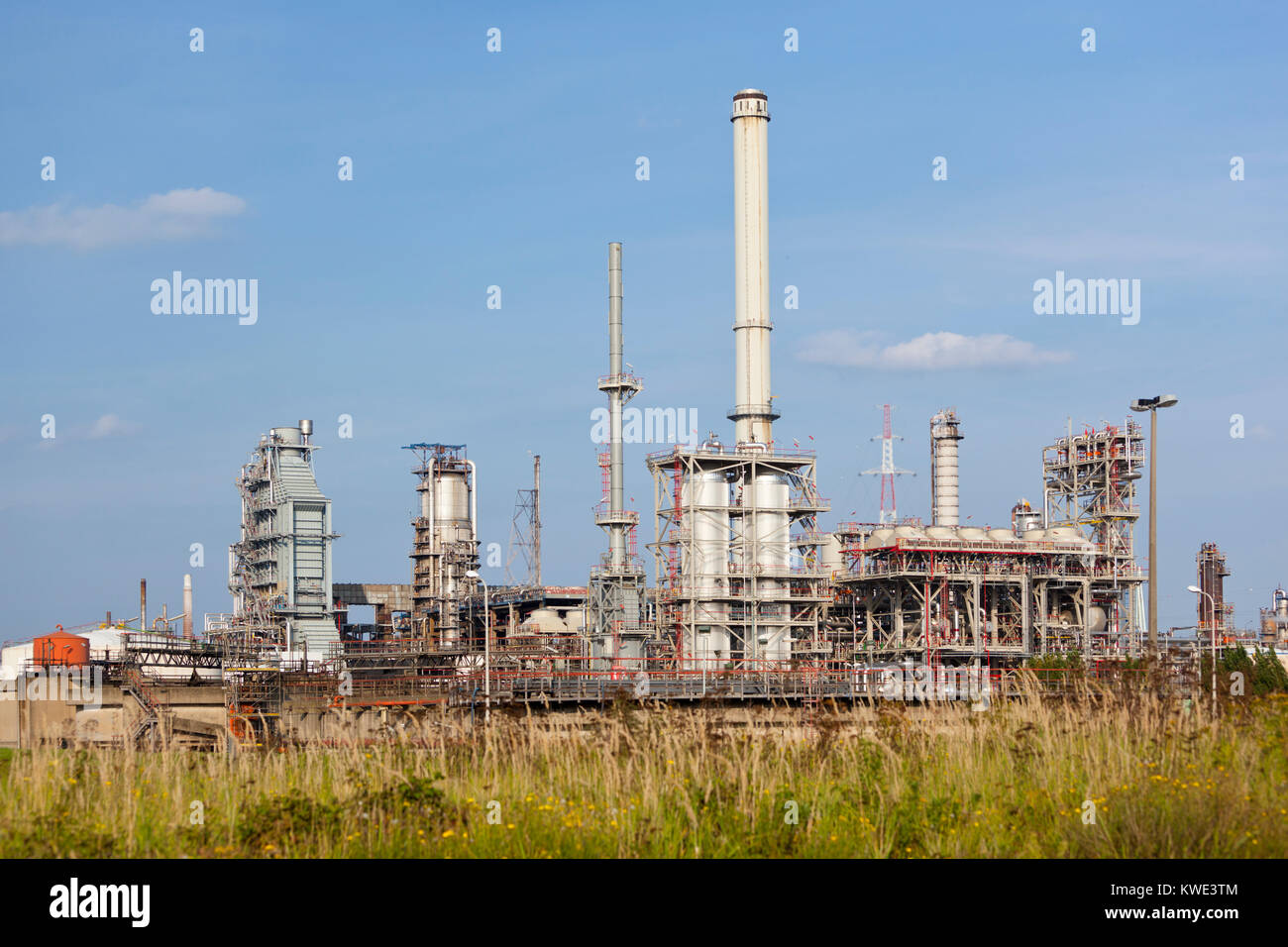 Some distillation towers and smoke stacks in a large refinery Stock ...