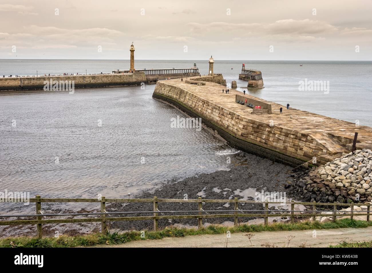 Whitby lighthouse and two piers hi-res stock photography and images - Alamy