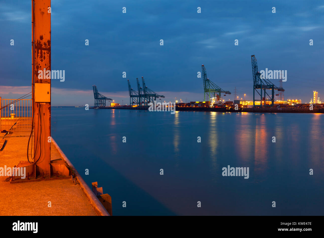 A container terminal with tall cranes. Night shot taken in Antwerp ...