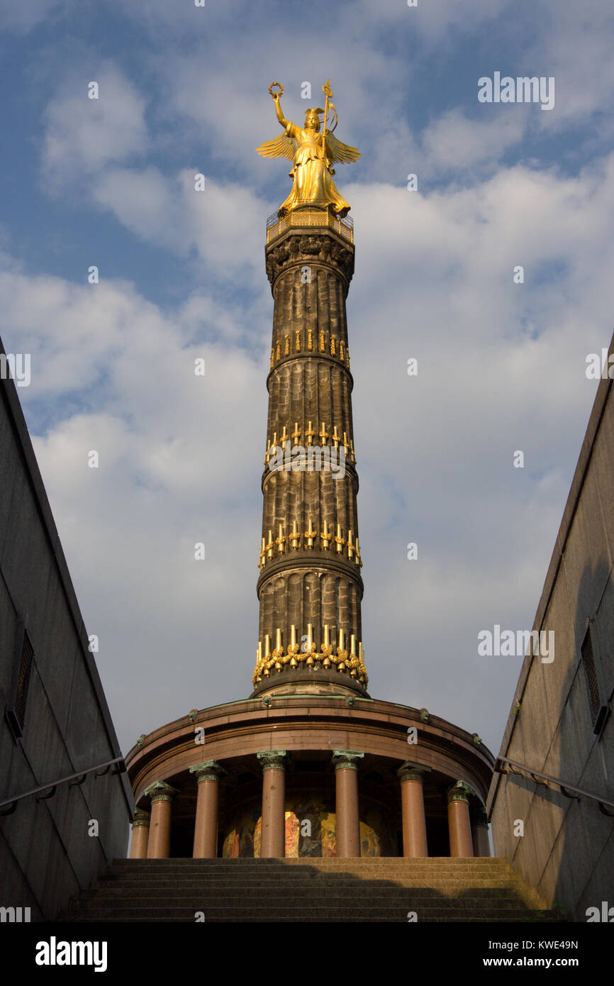 The famous victory column in Berlin seen from below in warm evening ...