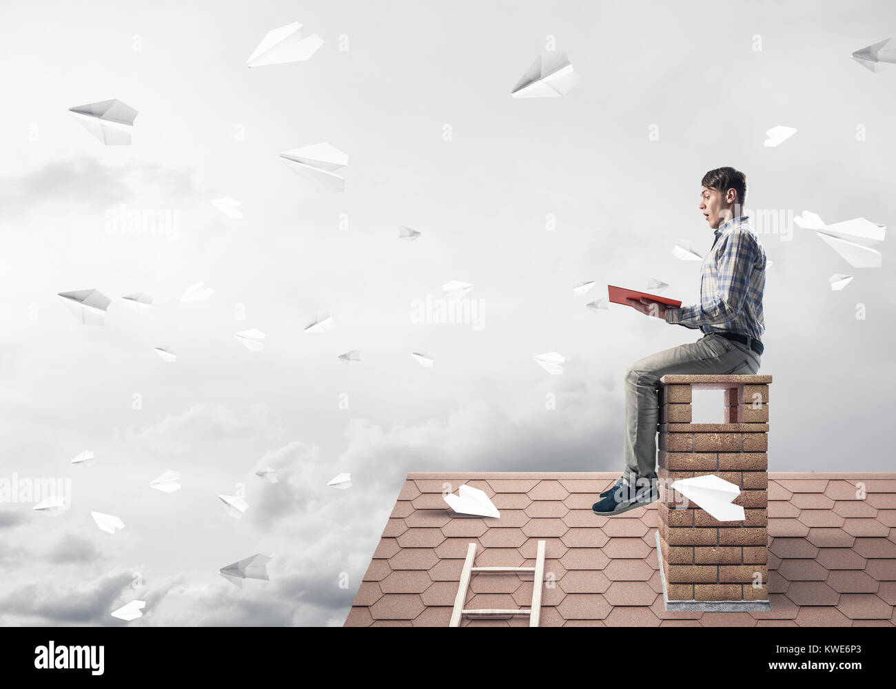 Handsome student guy reading book and paper planes flying in air Stock ...