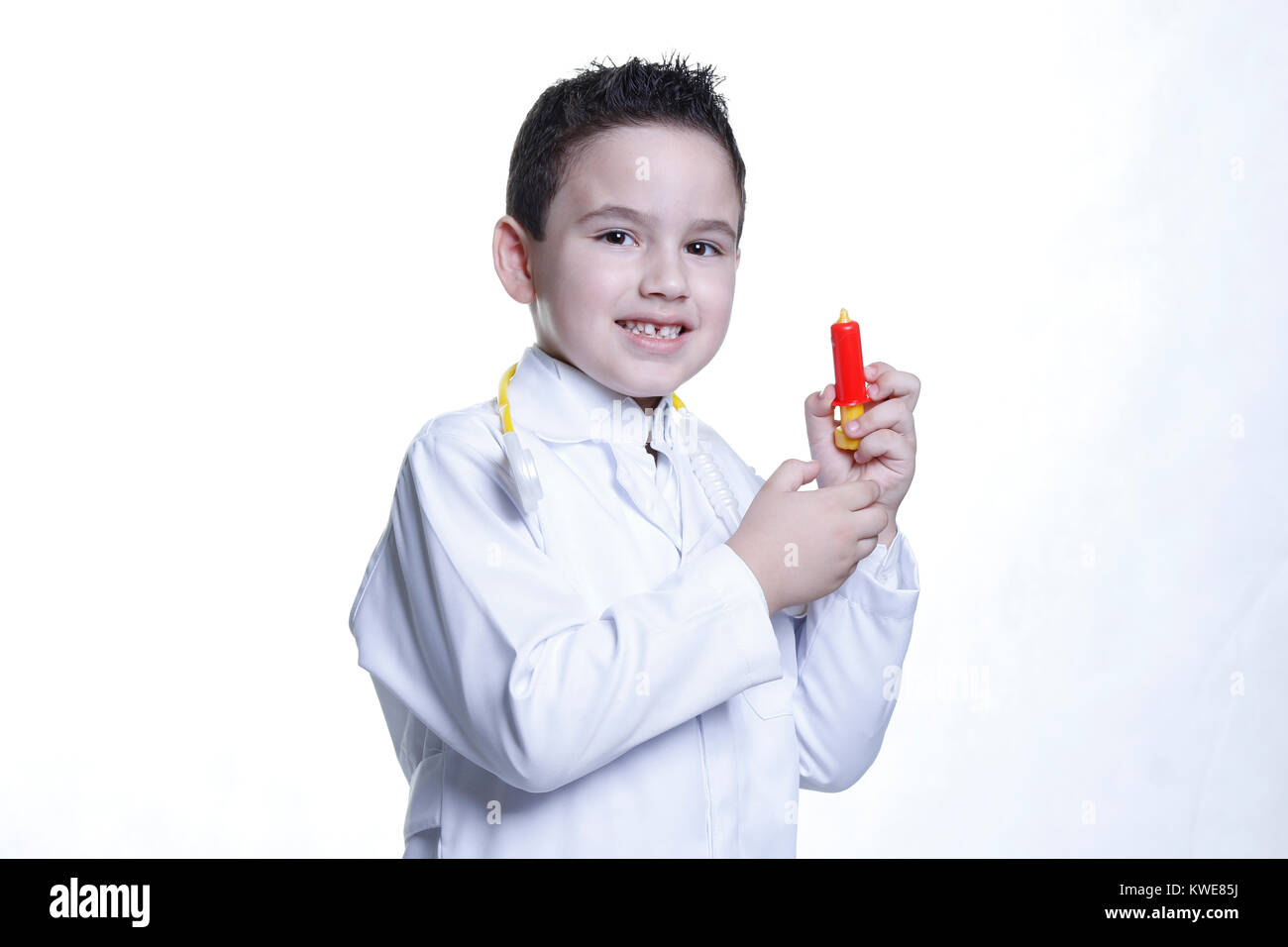 happy child wearing medical clothes and toy instruments Stock Photo - Alamy