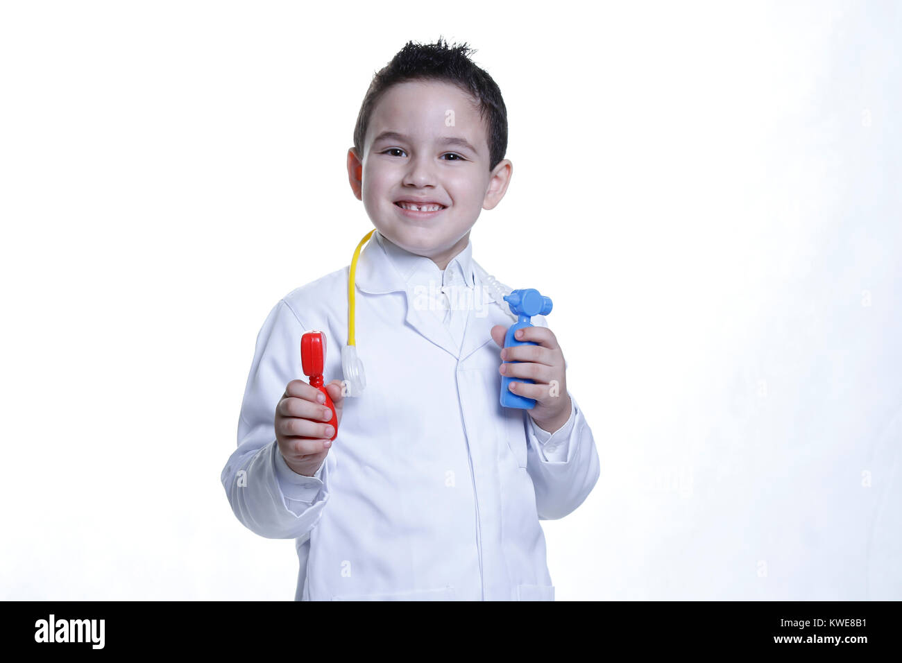 happy child wearing medical clothes and toy instruments Stock Photo - Alamy