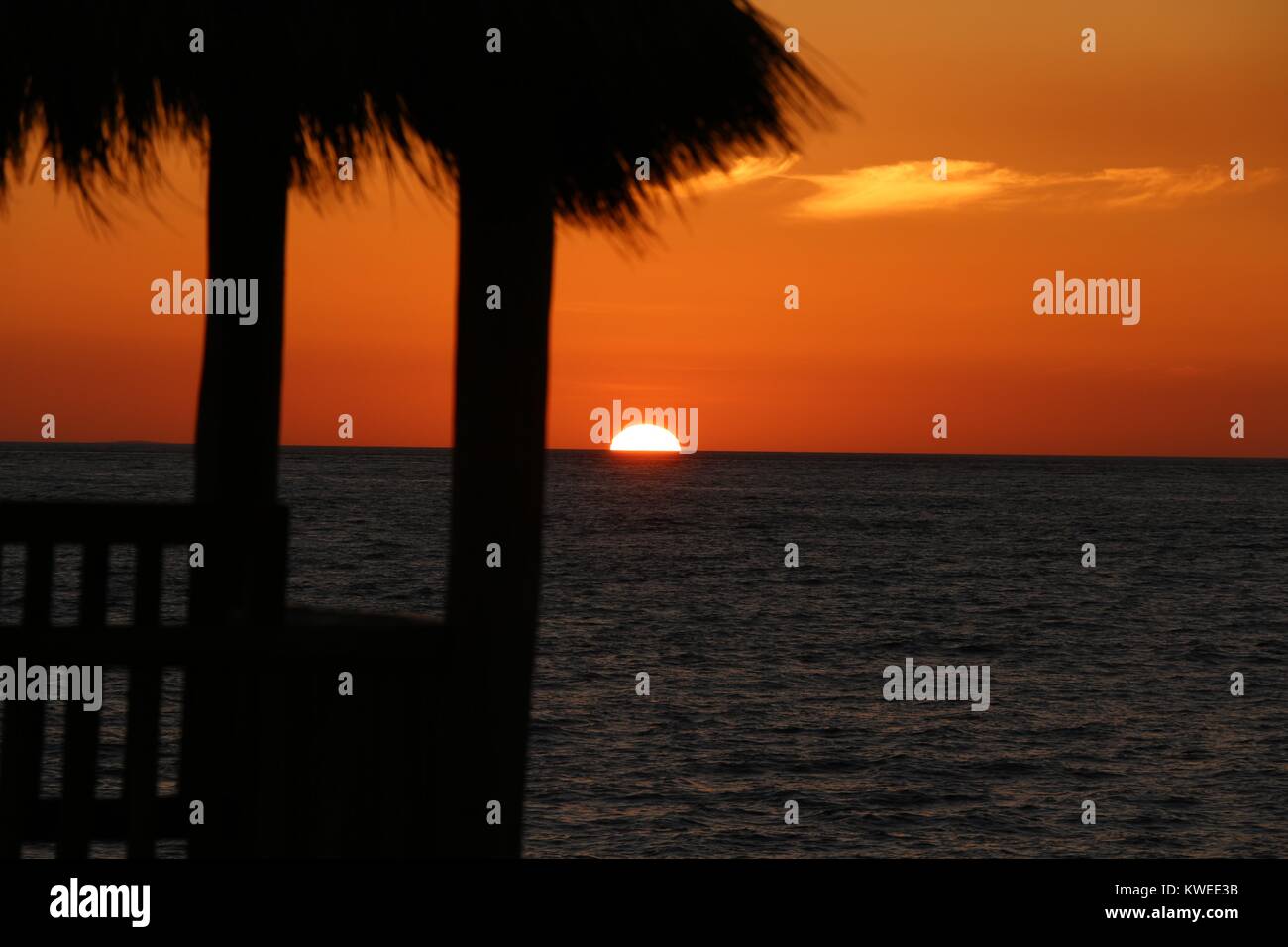 Setting Sun Over Caribbean Stock Photo - Alamy