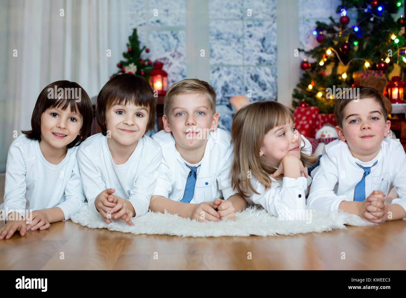 Five cute children, brothers, sister, siblings and friends, having fun ...