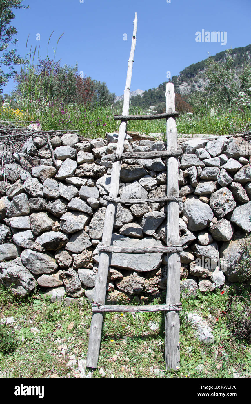 Step-ladder near stone wall in the farm, Turkey Stock Photo - Alamy