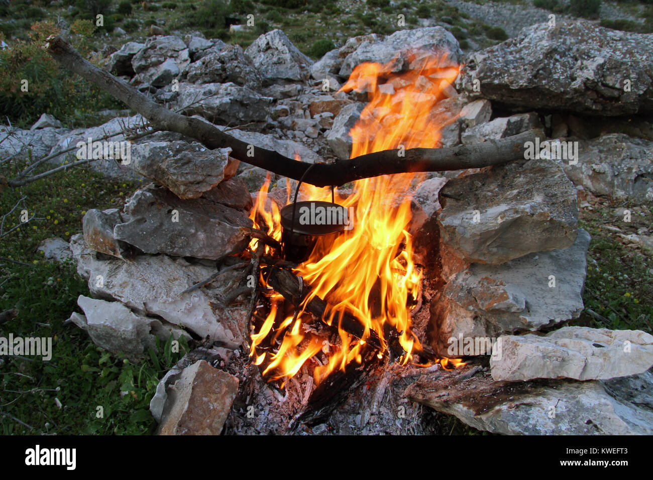 Bonfire with boiling pot Stock Photo - Alamy