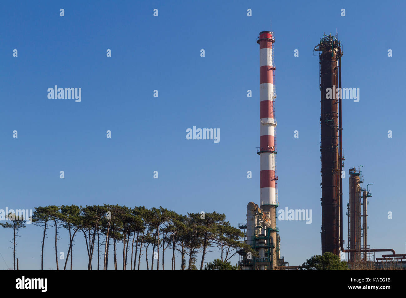 Close up view of refinery chimneys Stock Photo - Alamy
