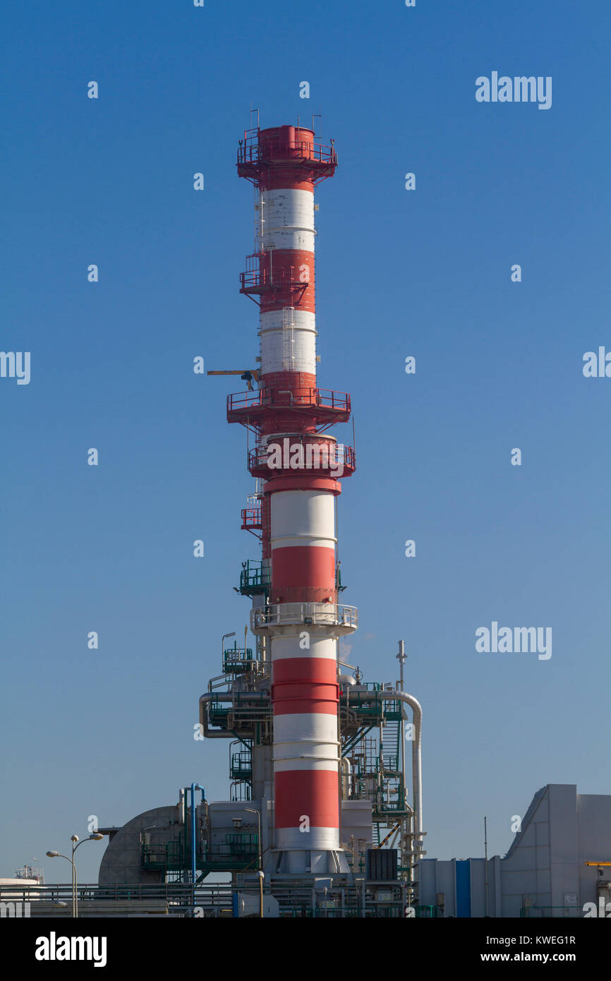 Close up view of refinery chimneys Stock Photo - Alamy