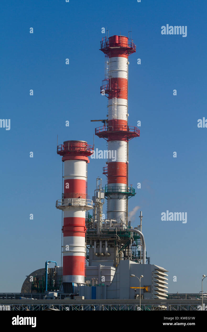 Close up view of refinery chimneys Stock Photo - Alamy