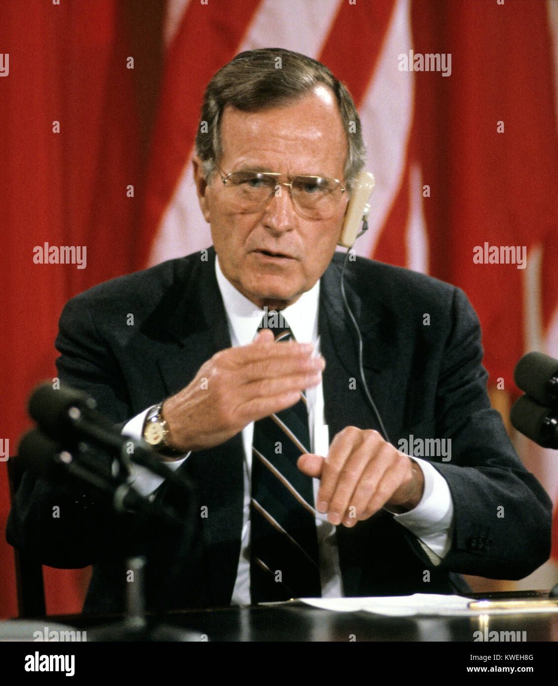 United States President George H.W. Bush answers a reporter's question ...
