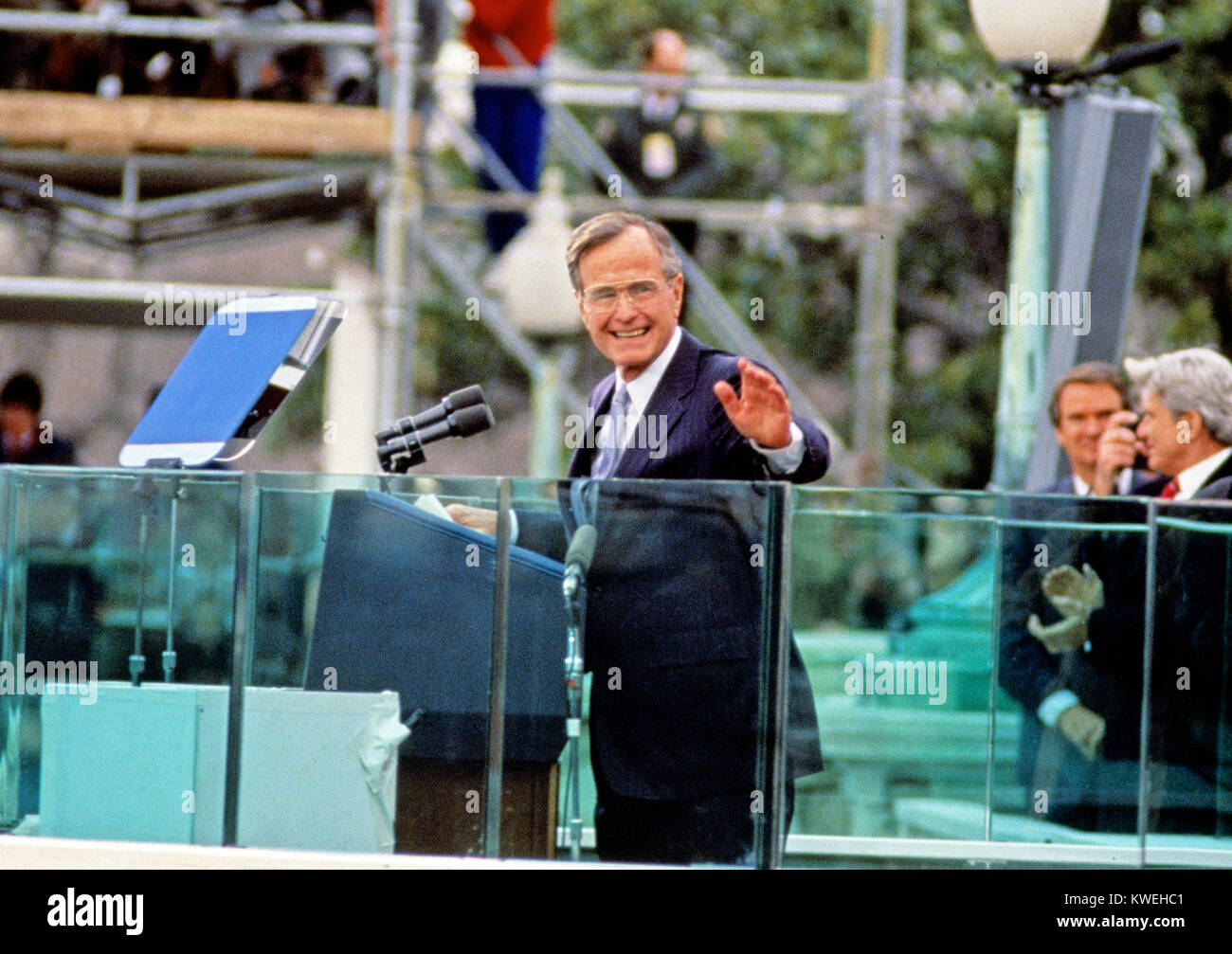 United States President George H.W. Bush waves to the crowd after being ...