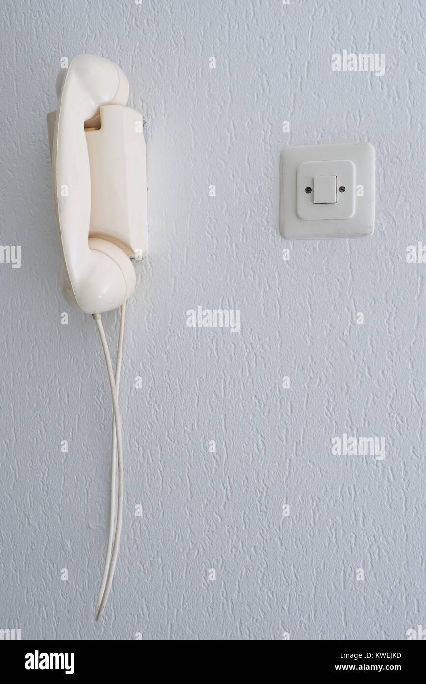 Old telephone mounted on wall hi-res stock photography and images - Alamy