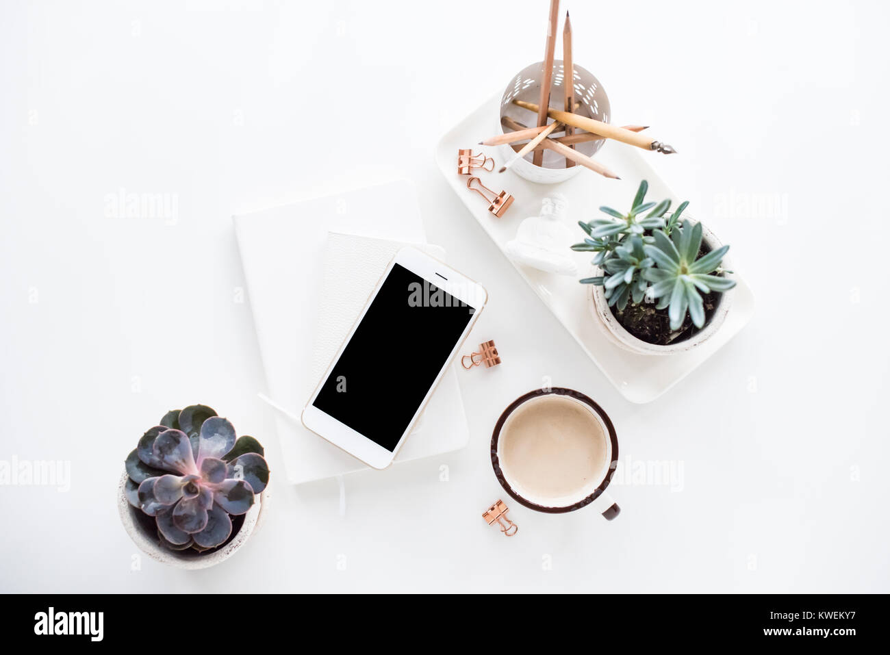 White home office desk flat lay with coffe, smartphone and succulents ...
