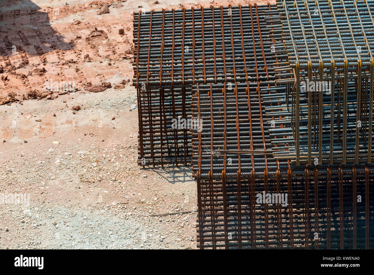 Cut steel bars and rods sitting on the ground of a construction site ...