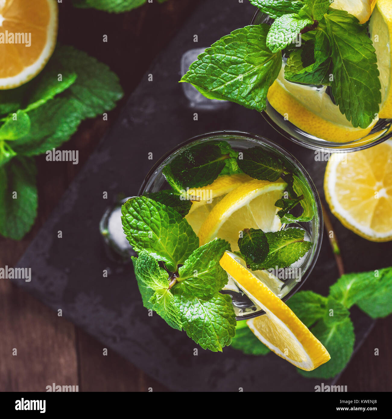 Top view of cool fresh lemonade in glasses with lemon and mint on a ...