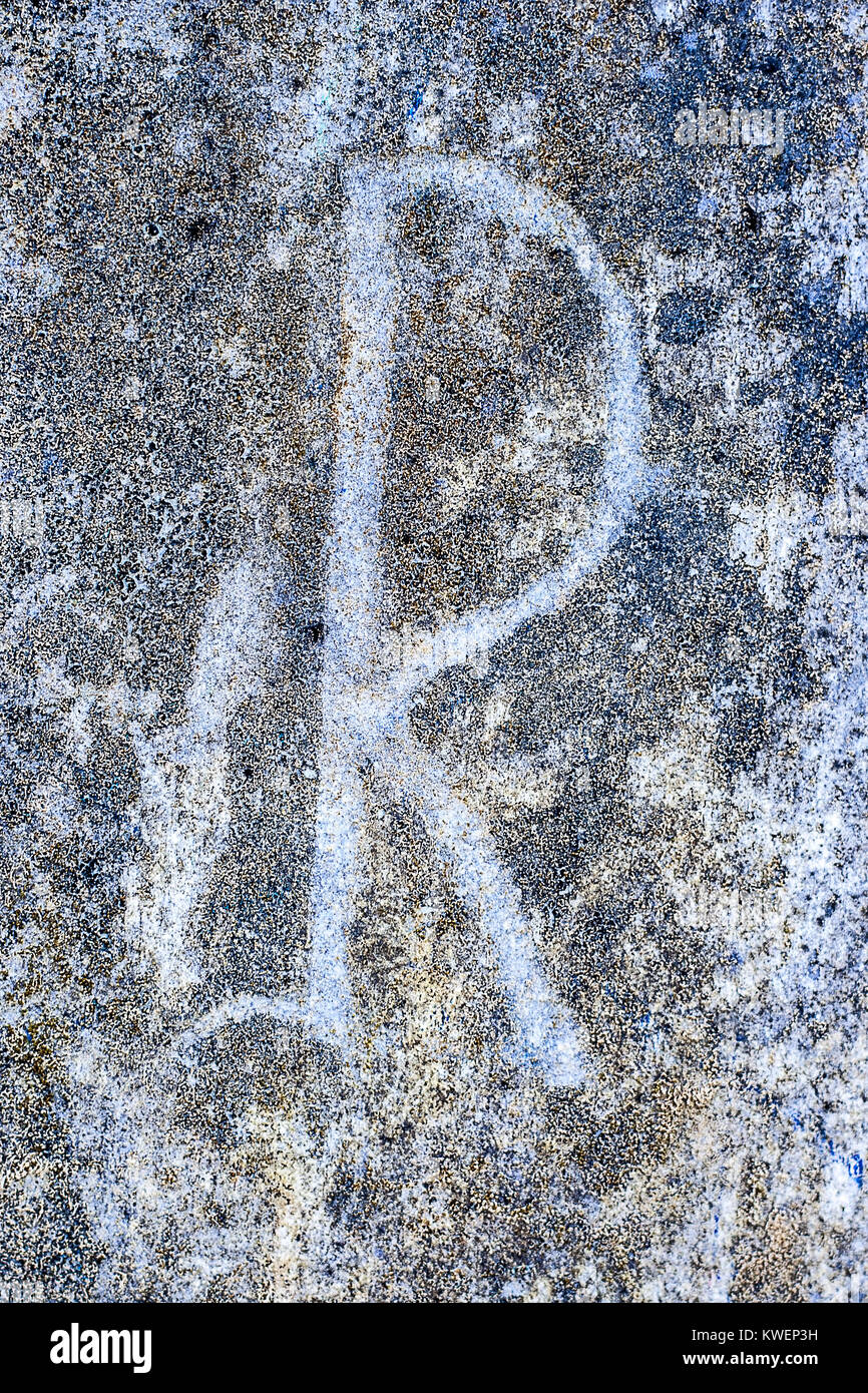 Alphabet 'R' written on rough surface Stock Photo - Alamy