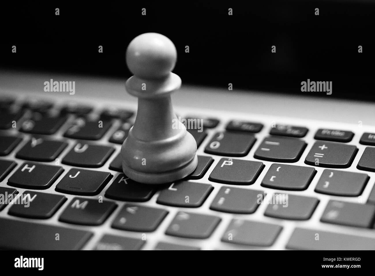 Chess pawns / kings on laptop keyboard - digital strategy Stock Photo ...