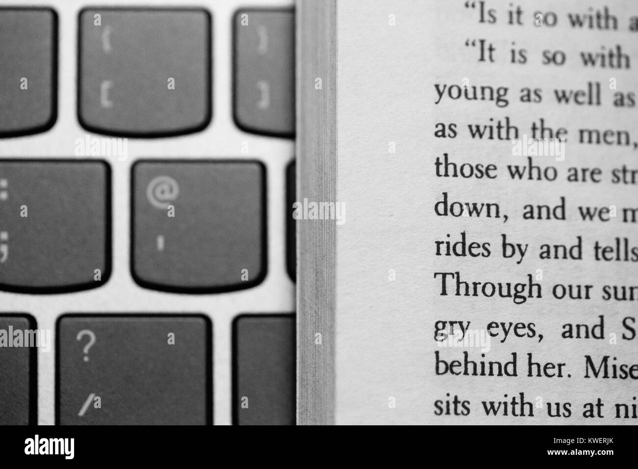 Closeup of classical english book on laptop keyboard - print versus ...
