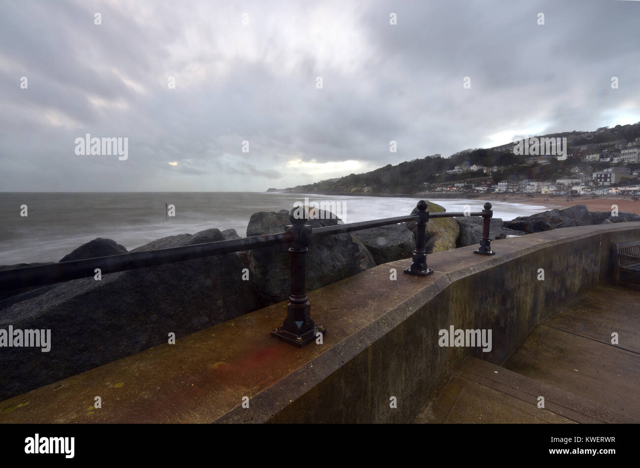 An atmospheric seascape with a dark, brooding and threatening sky over ...