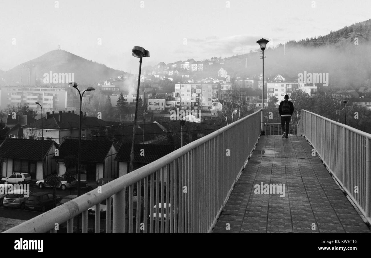 a young man on a pedestrian bridge Stock Photo - Alamy