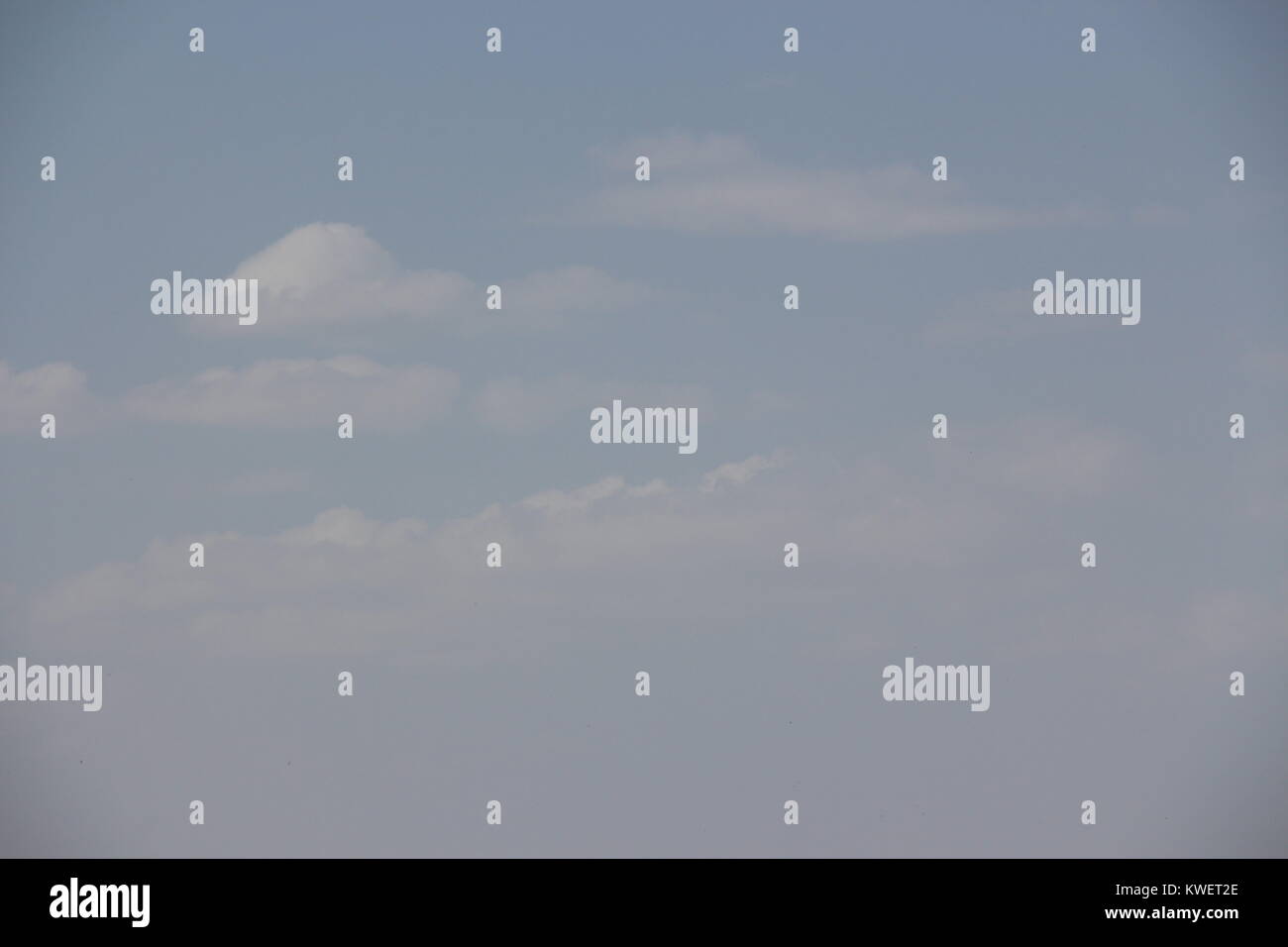 Clear blue daylight sky with white clouds and sunlight. Natural ...
