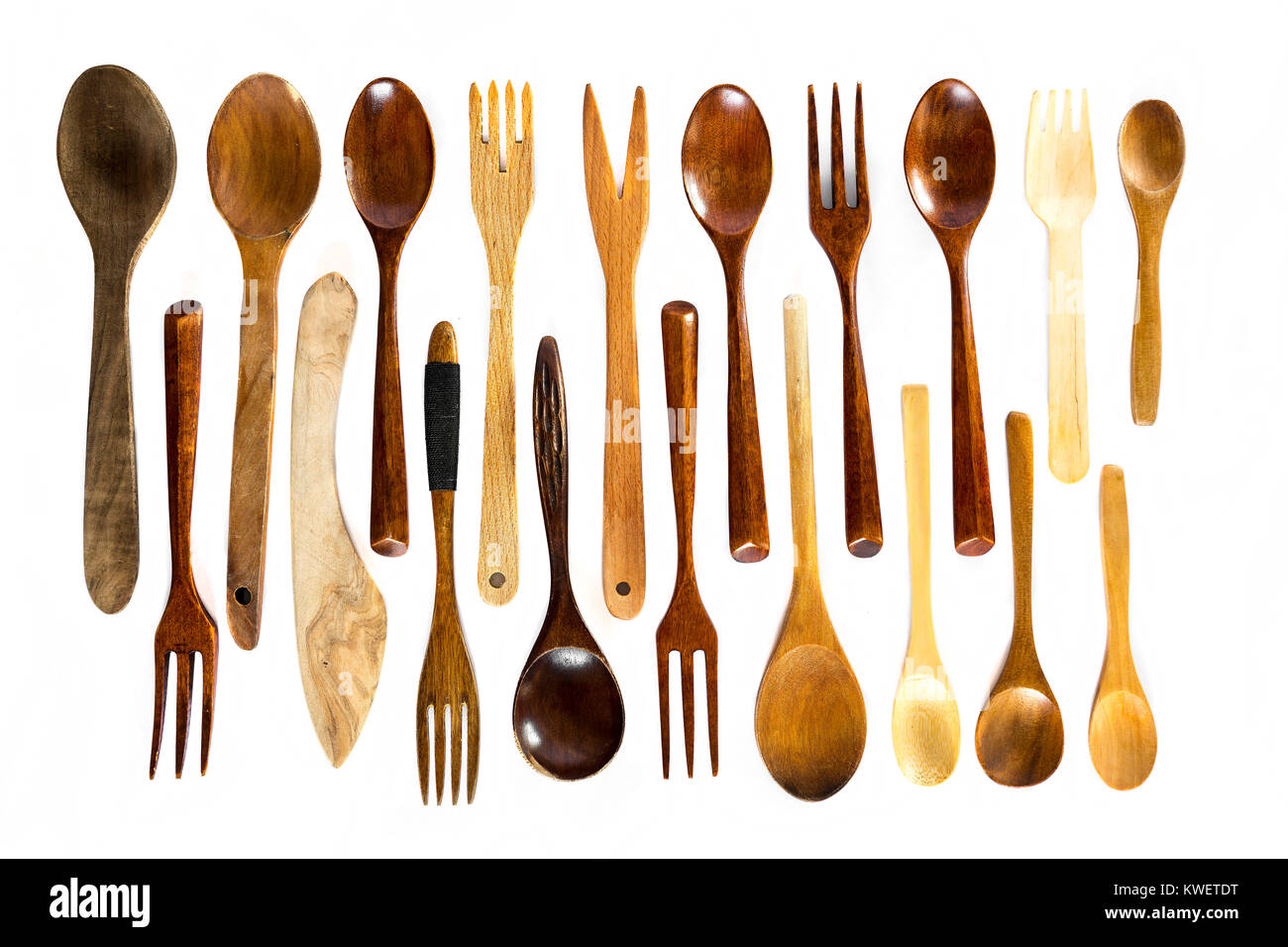 Wooden forks and spoons on a white background. Studio shot. Set of ...