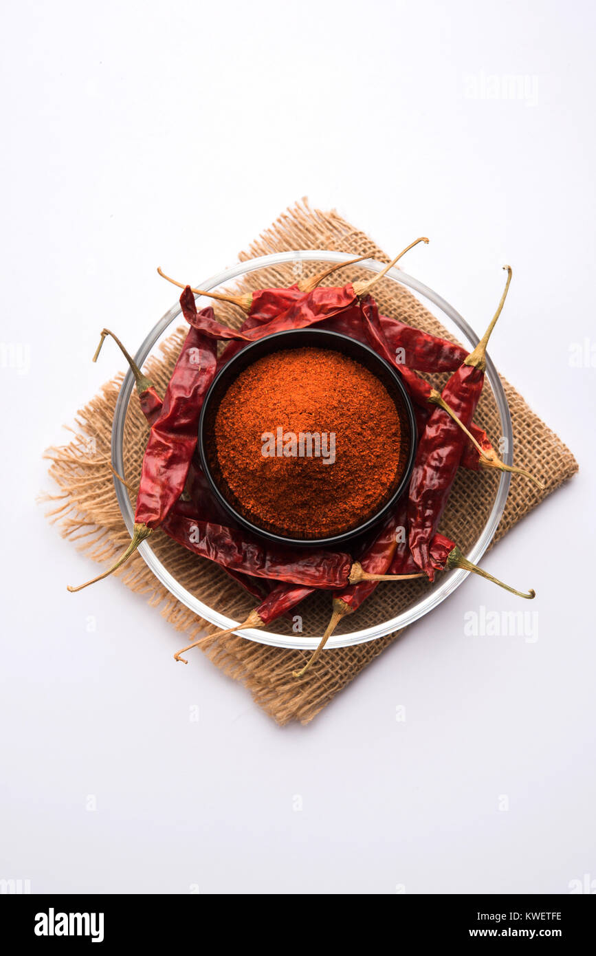 Red Chilly Powder in a bowl with dried red chillies over colourful ...