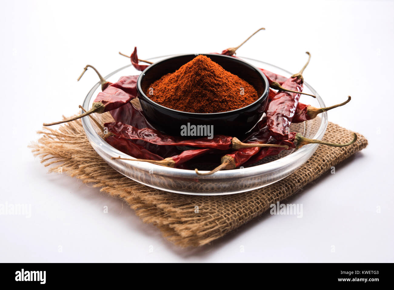 Red Chilly Powder in a bowl with dried red chillies over colourful ...