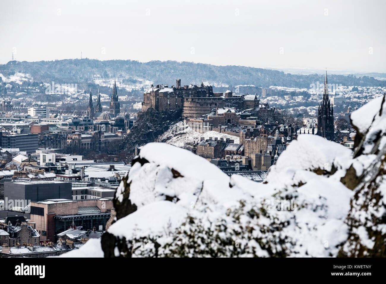 Snow falls on city of Edinburgh in December. Skyline view of city ...