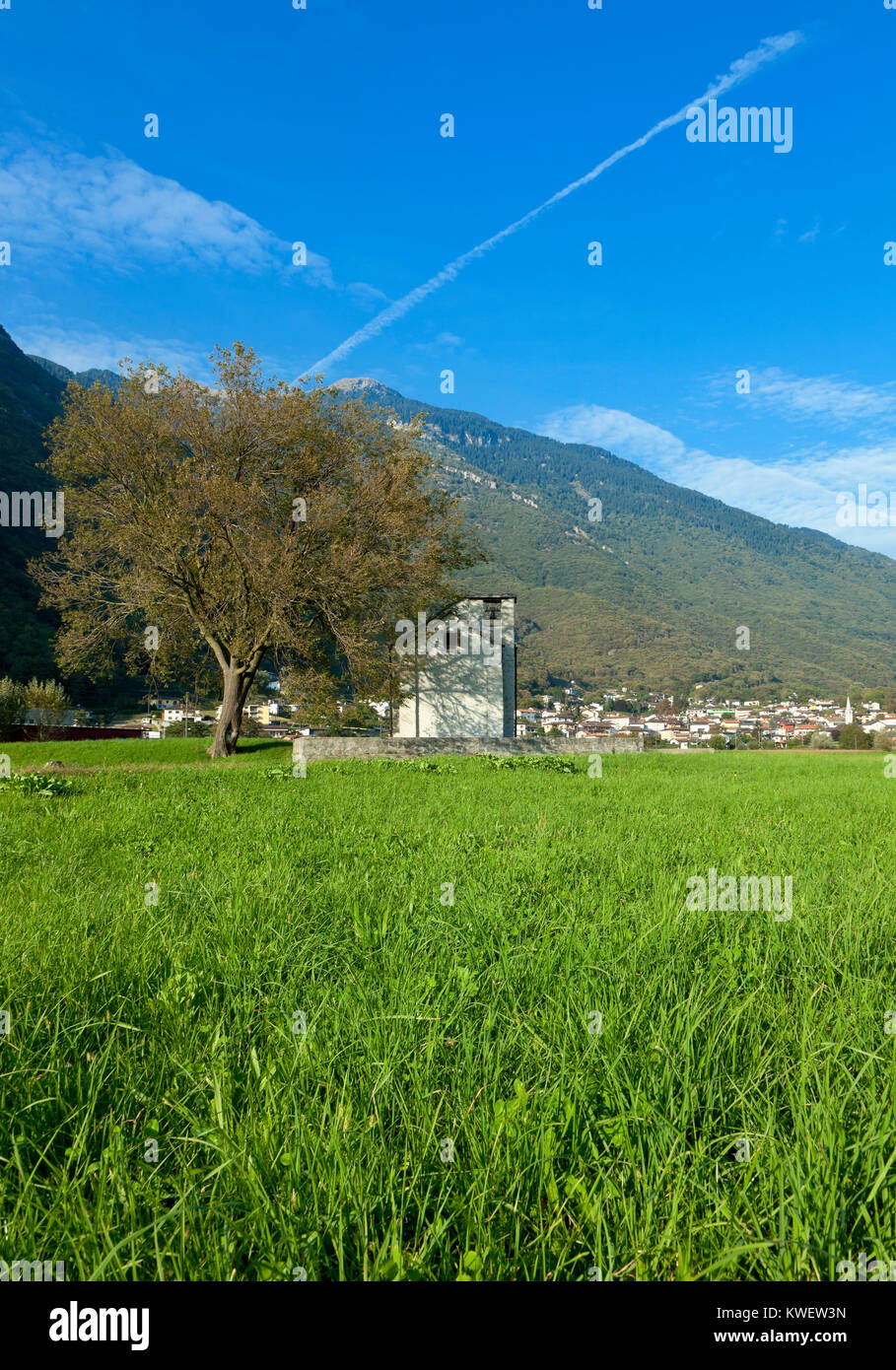 mountain landscape with tree and small church Stock Photo - Alamy