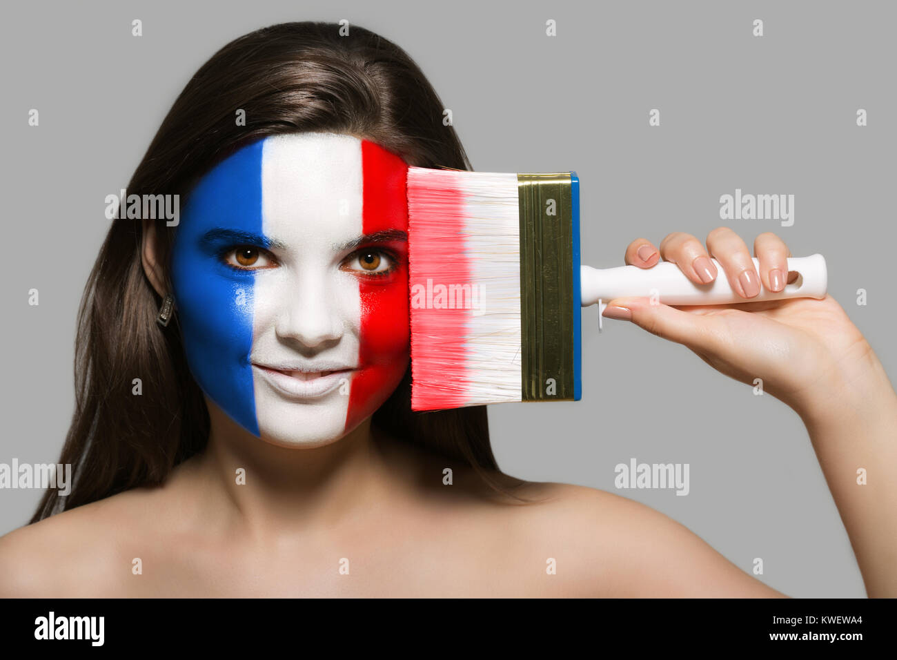 The face of a woman in the national colors of France Stock Photo - Alamy